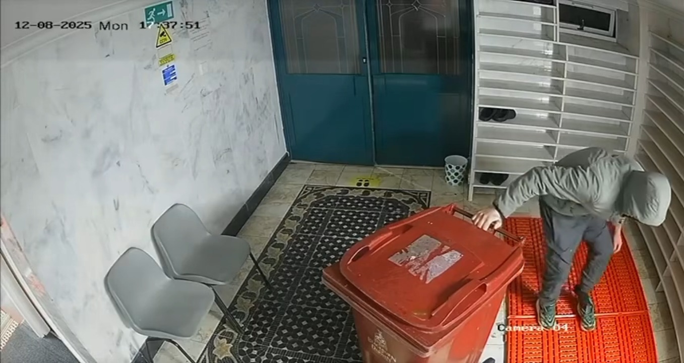 Burglar captured on CCTV taking his shoes off before stealing safe from ...